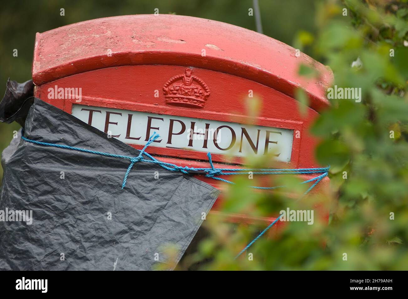 Traditional British GPO cast iron red telephone box, disused and ...