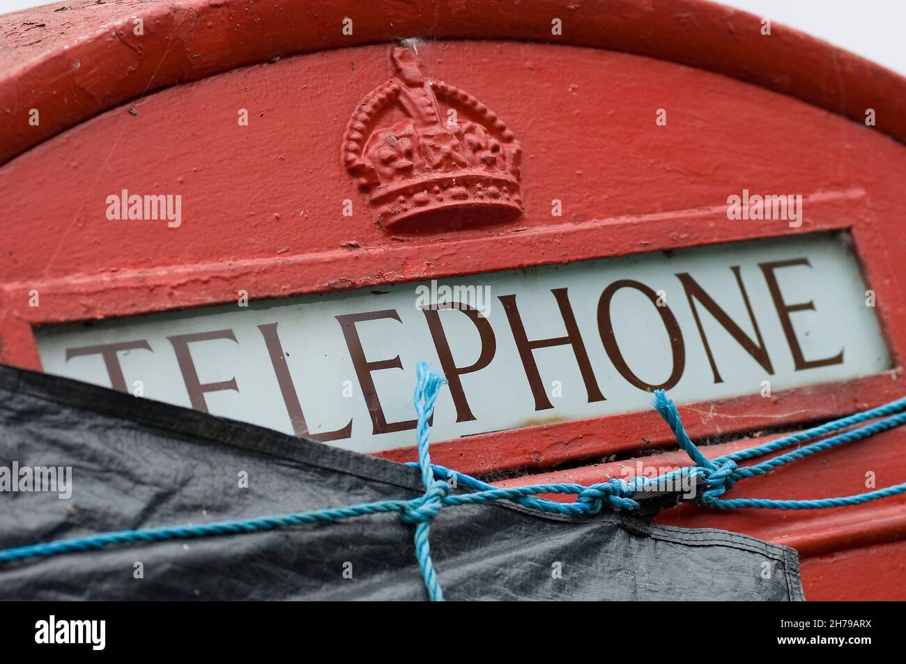 Traditional British GPO cast iron red telephone box, disused and ...