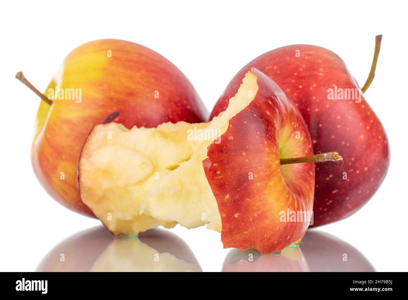 One sweet red bitten apple and two whole, close-up, isolated on white ...