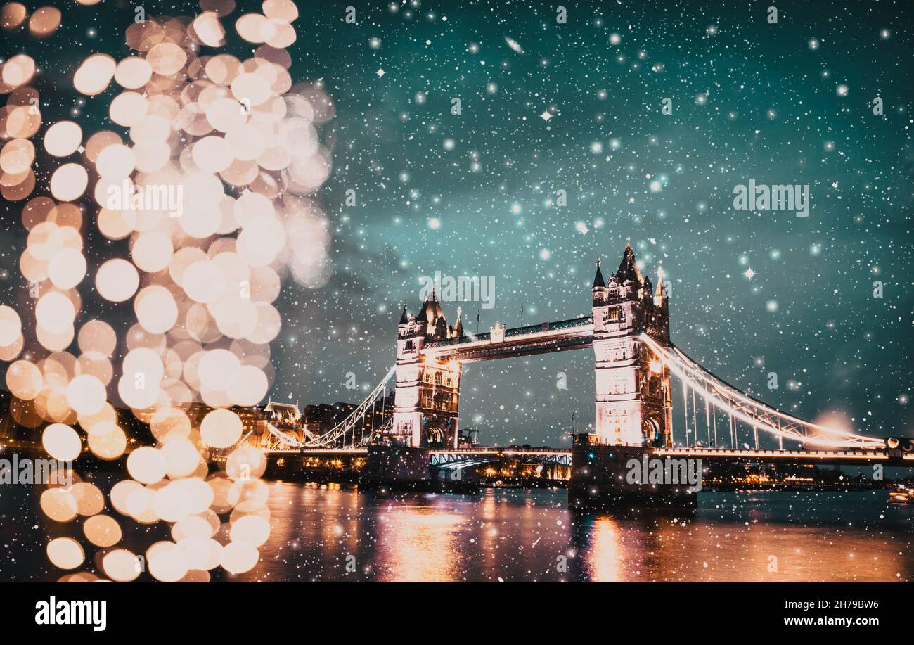 christmas lights and snow in London Tower bridge at night Stock Photo ...