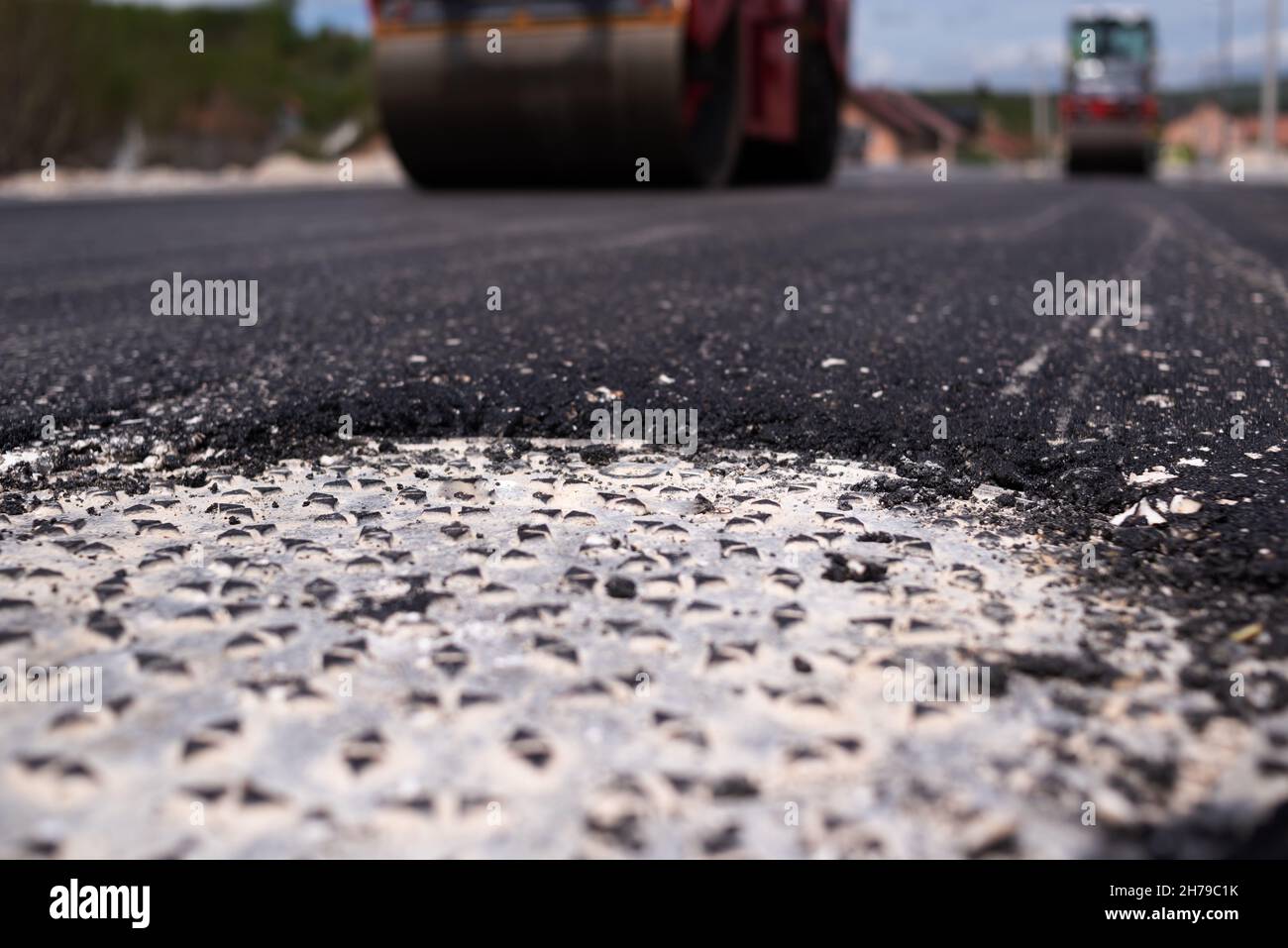 Urban road asphalting works. Asphalt paving. Paver machine and road ...