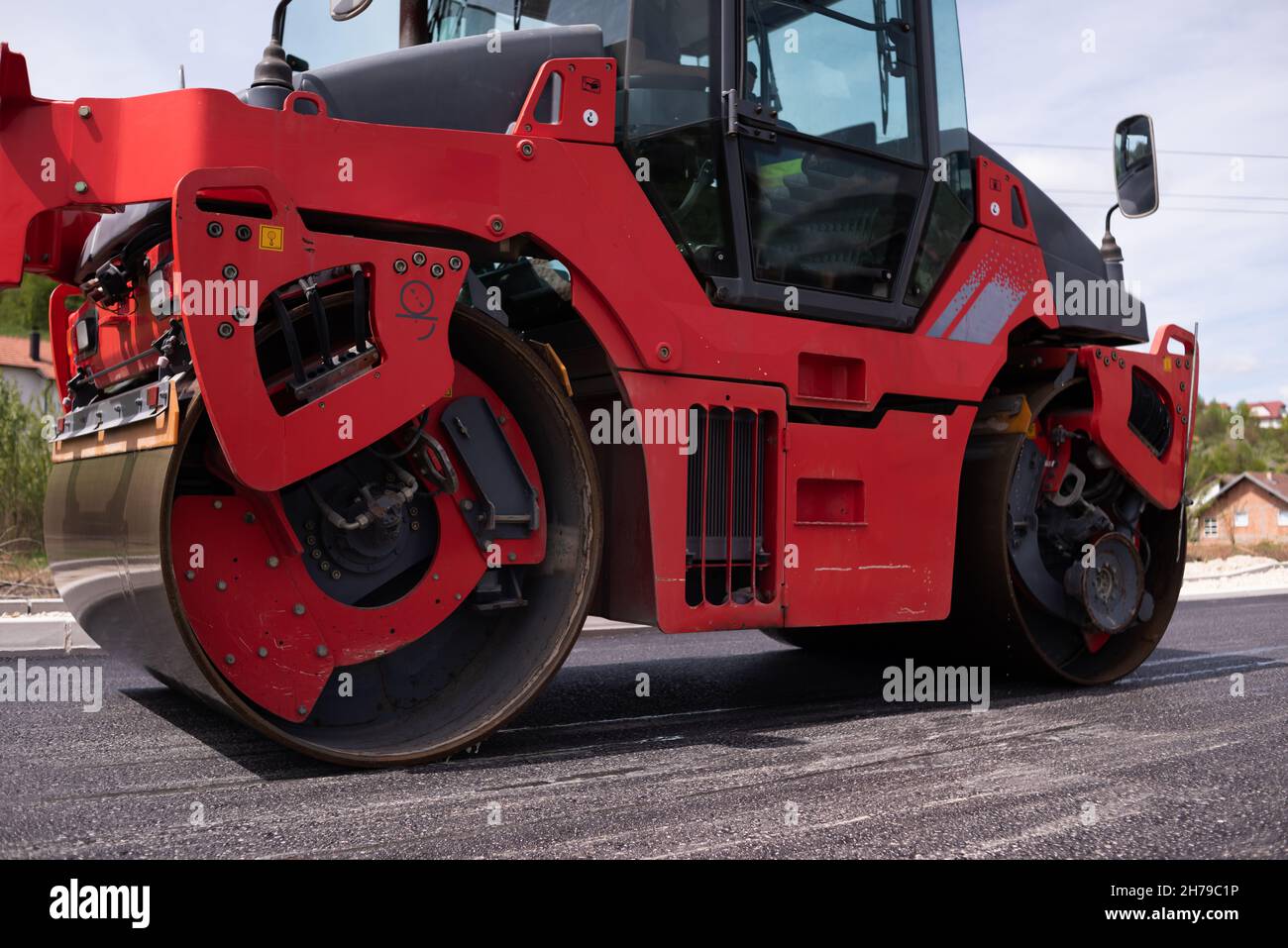 Urban road asphalting works. Asphalt paving. Paver machine and road ...