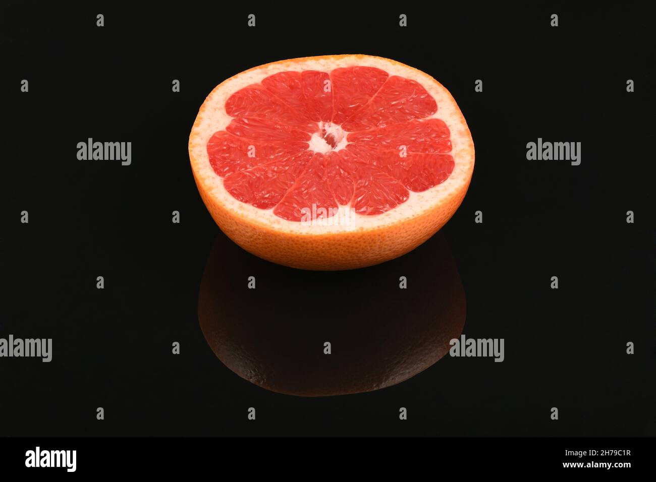 Grapefruit isolated on acrylic black background. High resolution photo ...
