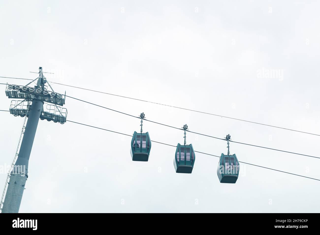 Three cable cars against cloudy sky in summer Stock Photo - Alamy