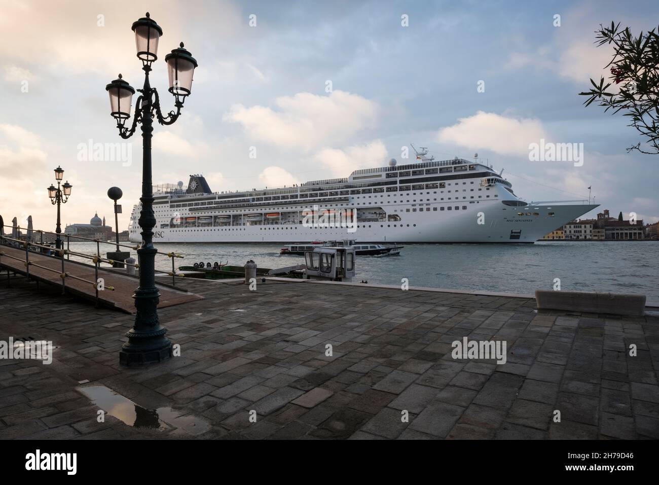 A cruise ship passes San Basilio along the Canale di Fusina in Venice ...