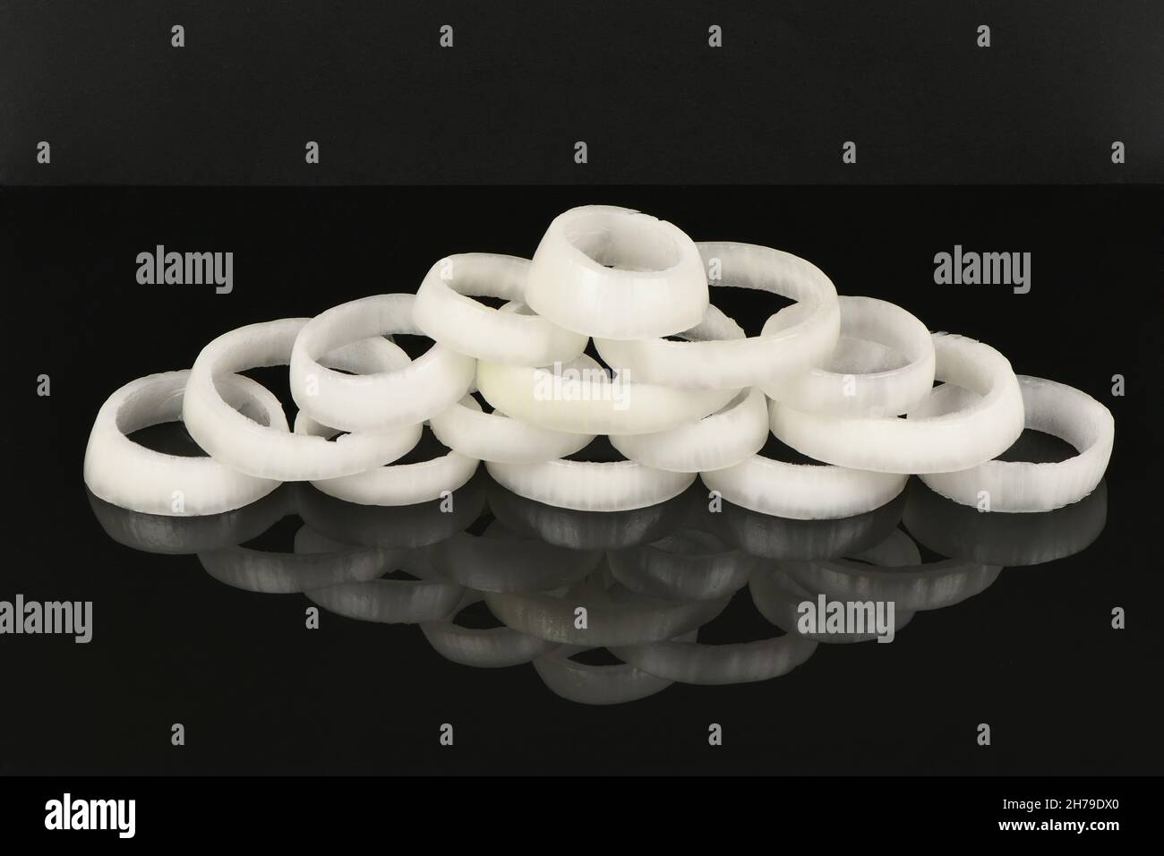 Sliced white onion rings isolated on acrylic black background. High ...