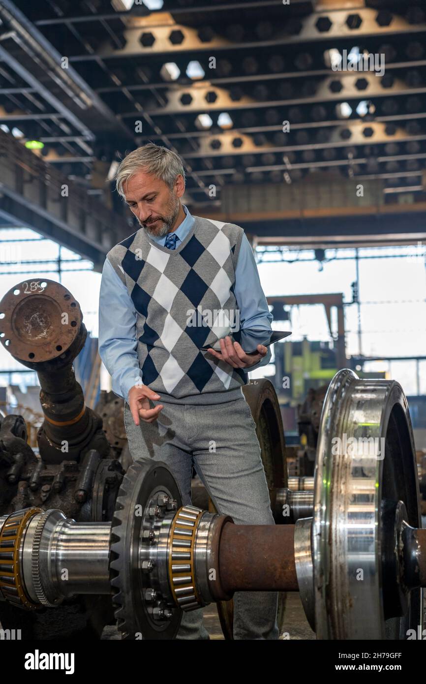 Portrait Of Mature Man In Industrial Environment. Area For Maintenance ...