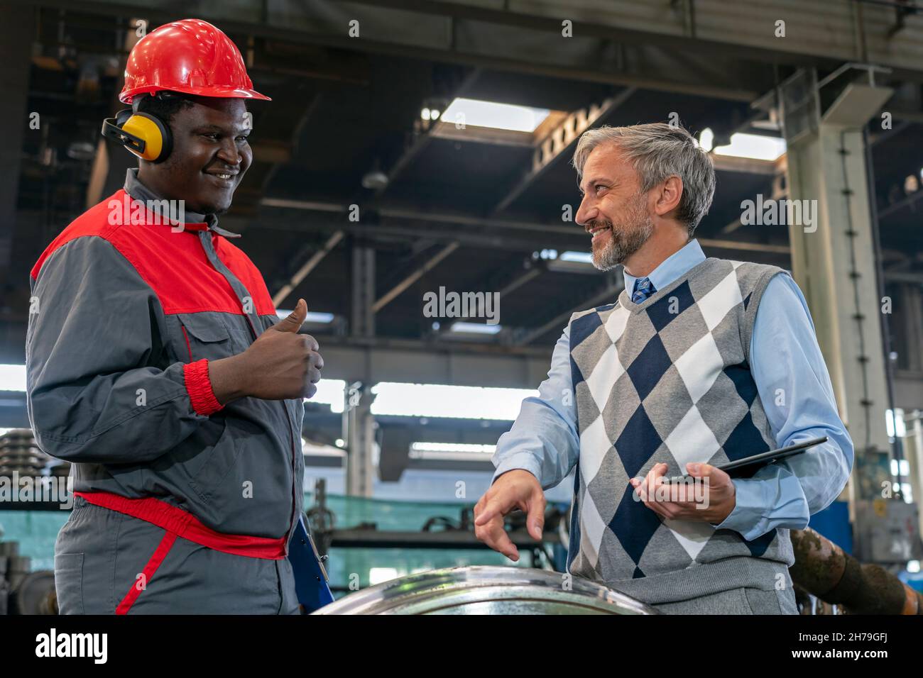 Multiracial Industrial Co-Workers Standing Next To Train Wheels ...