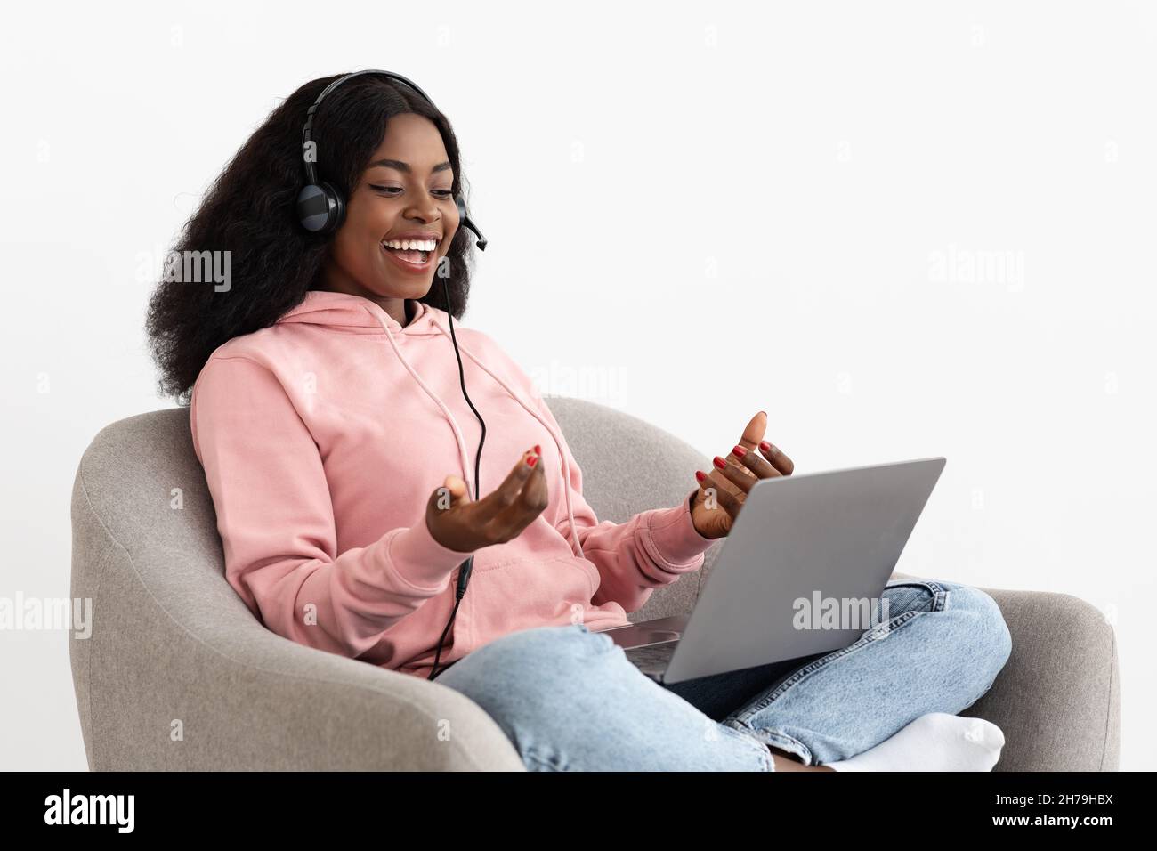Cheerful african american lady having video call, using laptop Stock ...