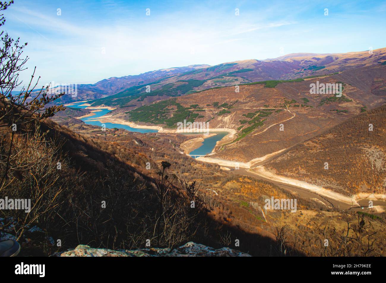 Blue wavy lake river in the middle of mountains in autumn with ultra ...