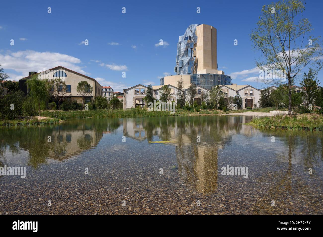 Luma Tower designed by Frank Gehry reflected in the Landscaped Gardens ...