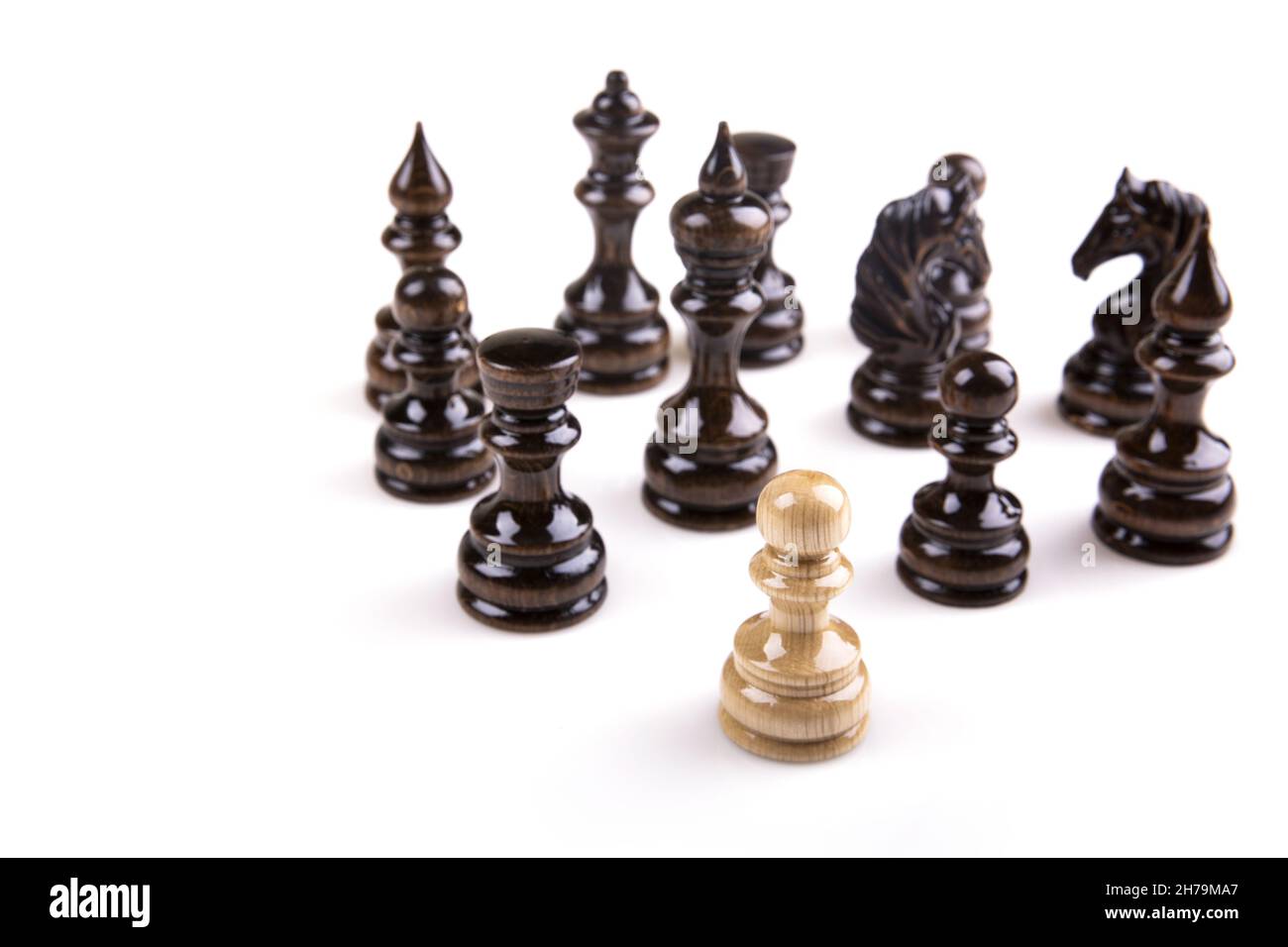 The brown chess pieces and one white pawn isolated on white background ...