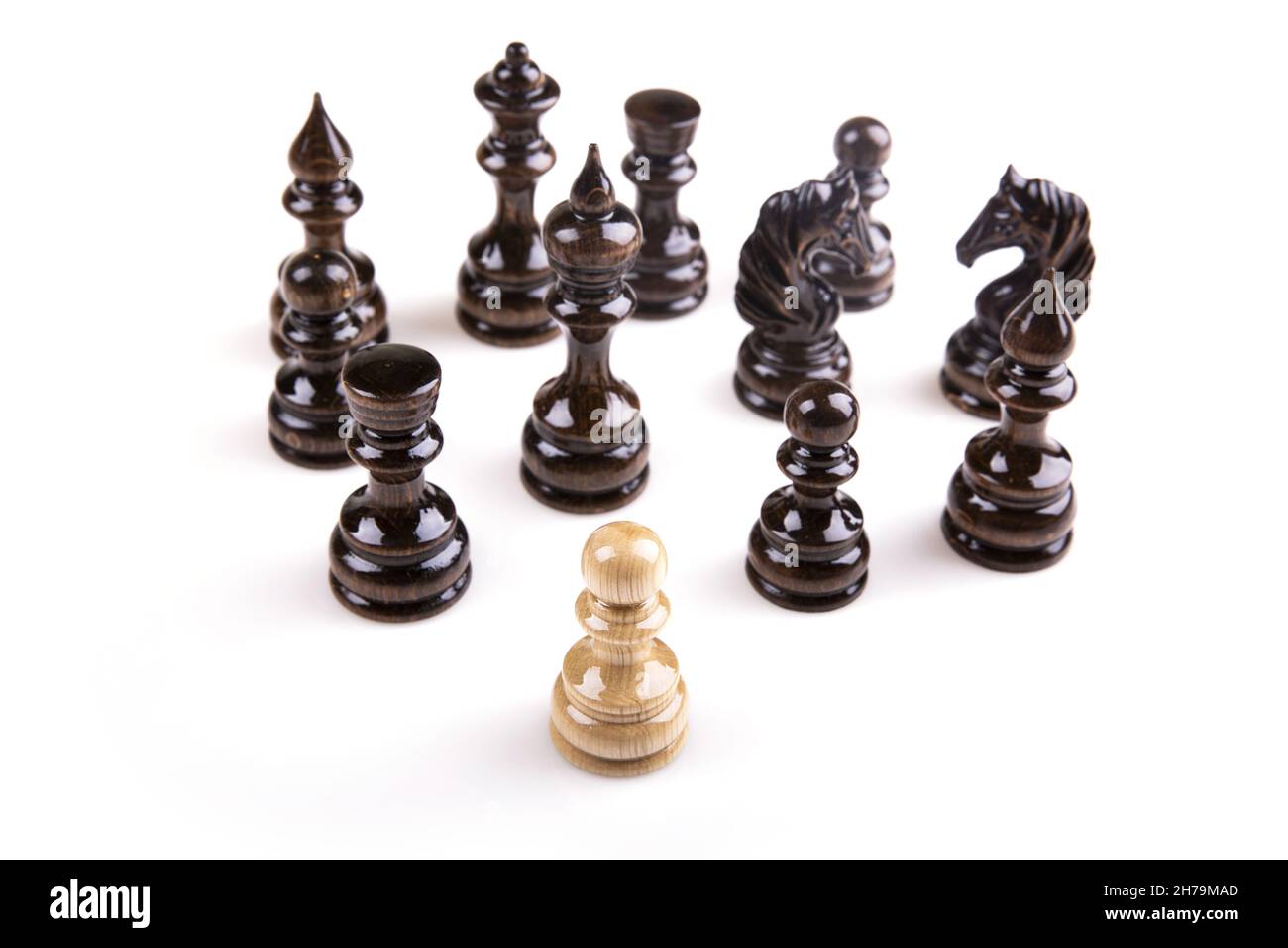 The brown chess pieces and one white pawn isolated on white background ...