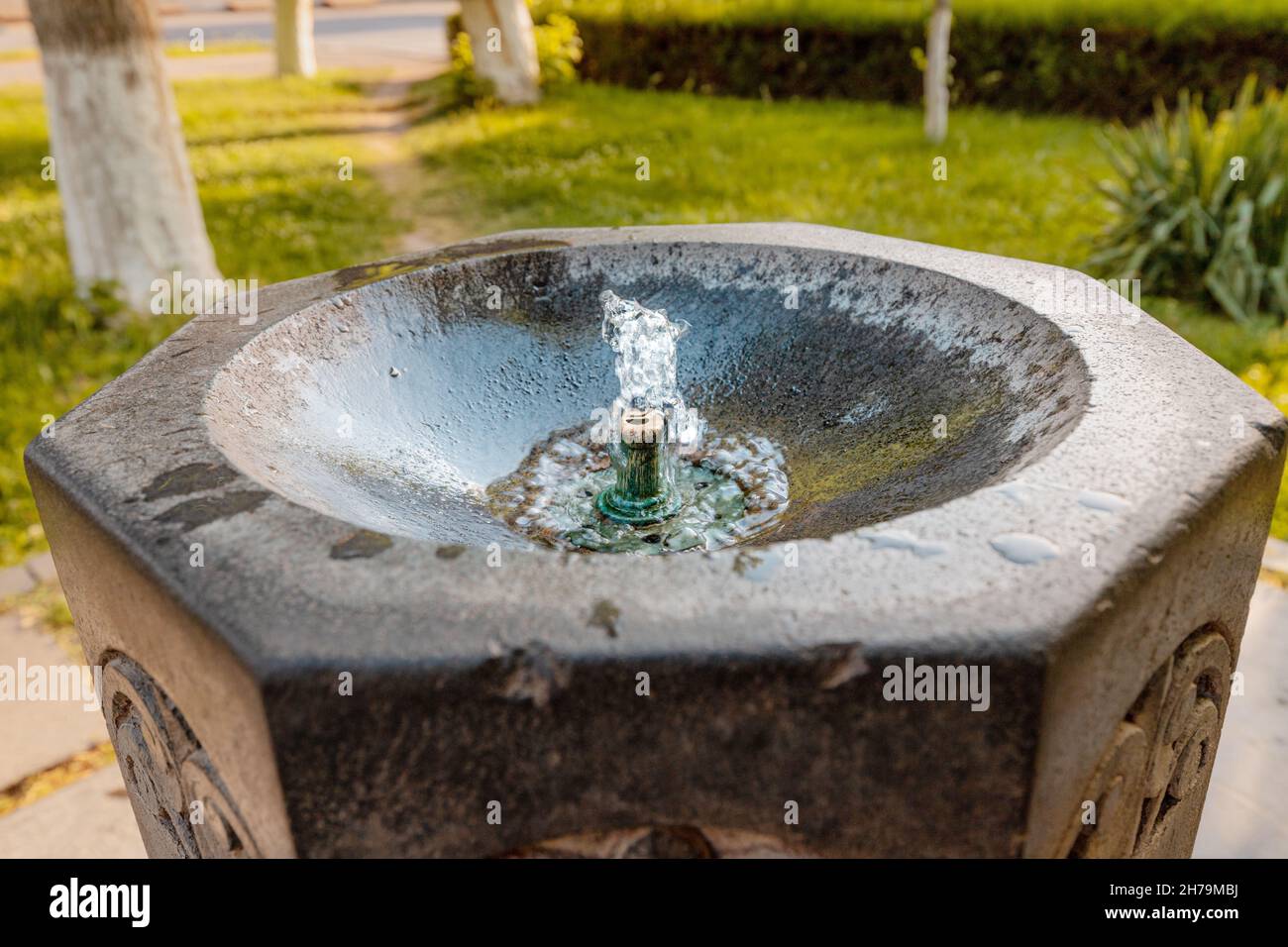 A drinking fountain on the street of the city. Clean water flows from ...