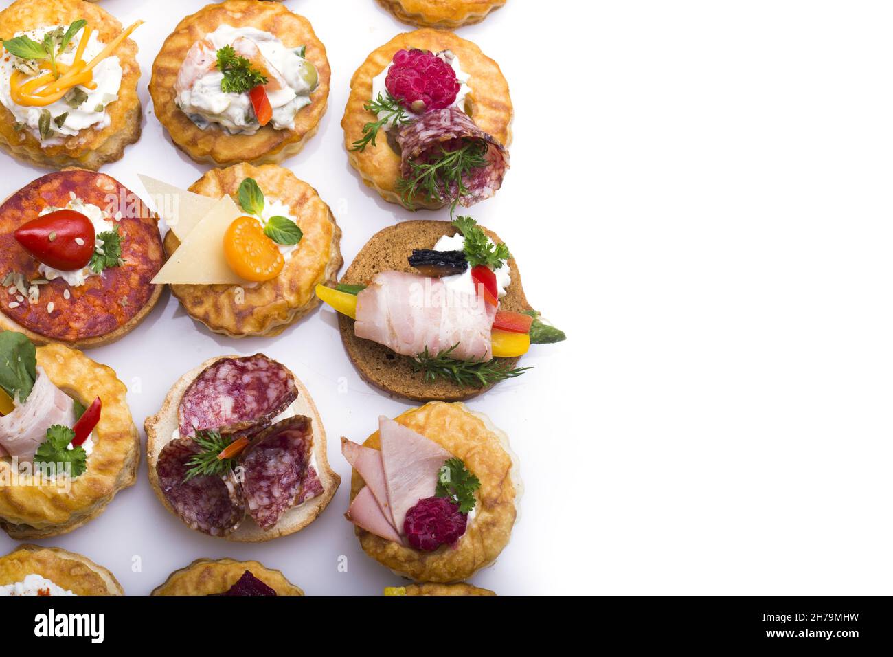 Top view of different kinds of canapes on white background Stock Photo ...