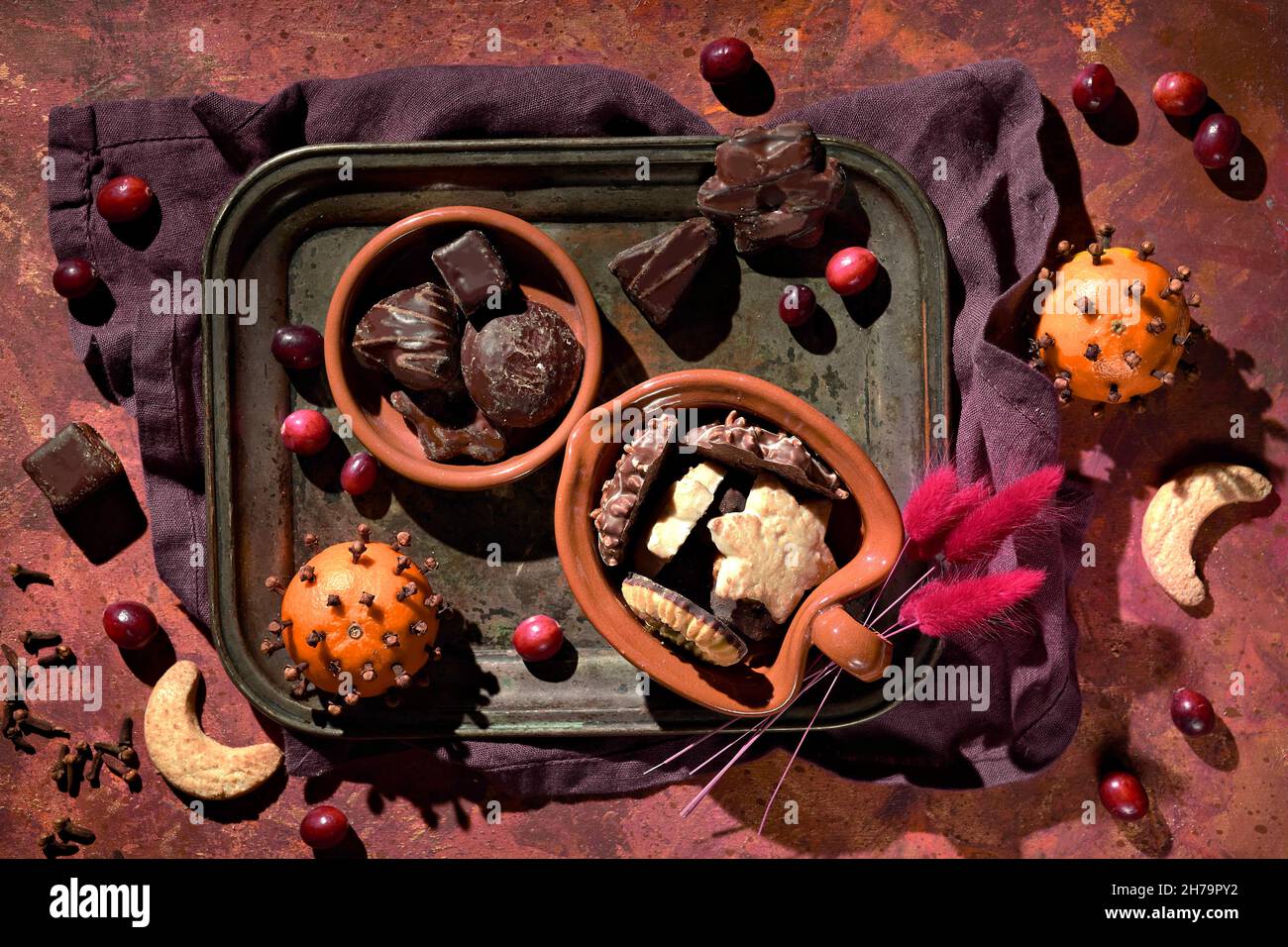 Wintertime sweets in Spanish ceramic dishes. Various gingerbread , star ...