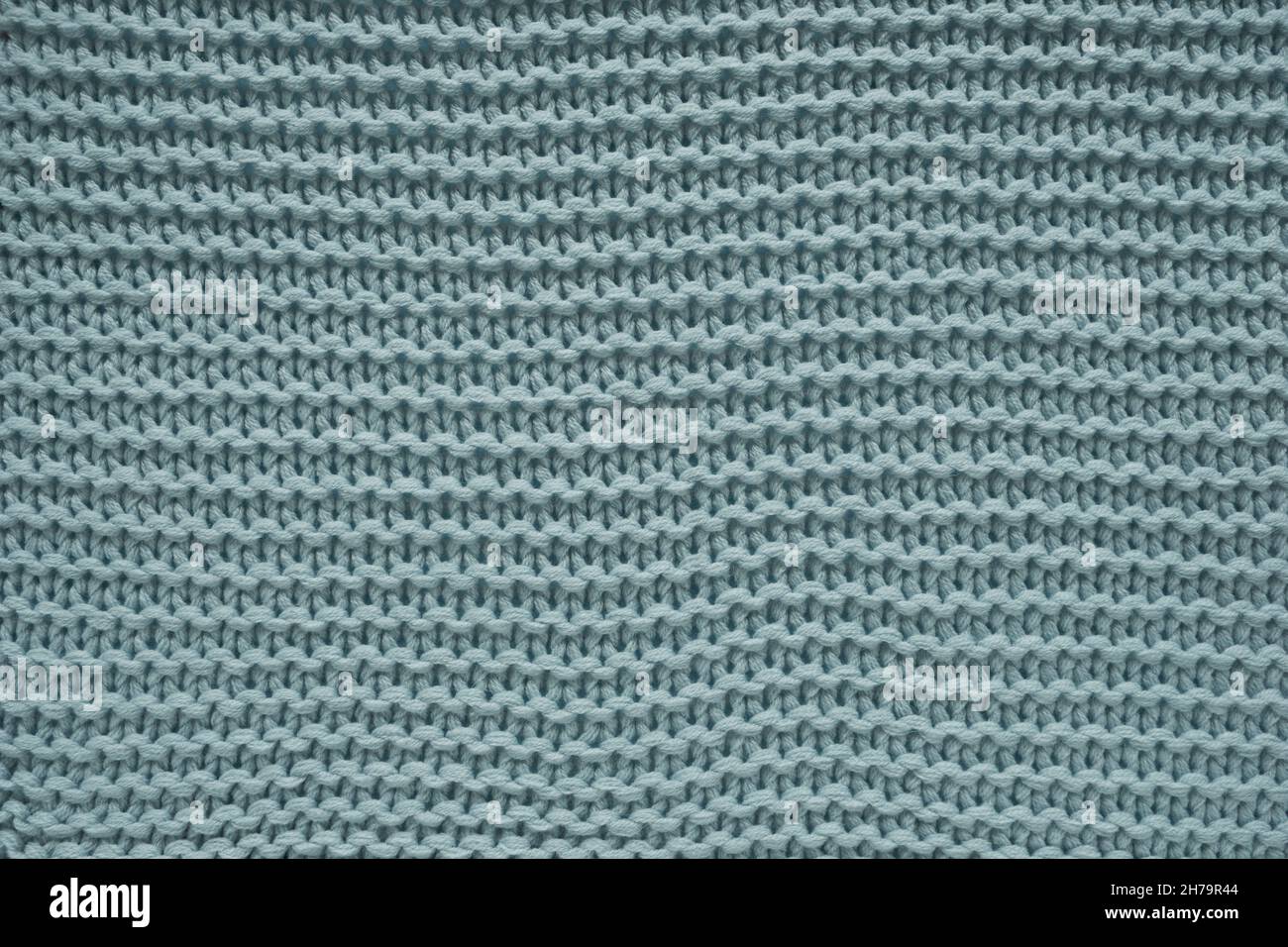 Pale blue knitted fabric texture background Stock Photo - Alamy