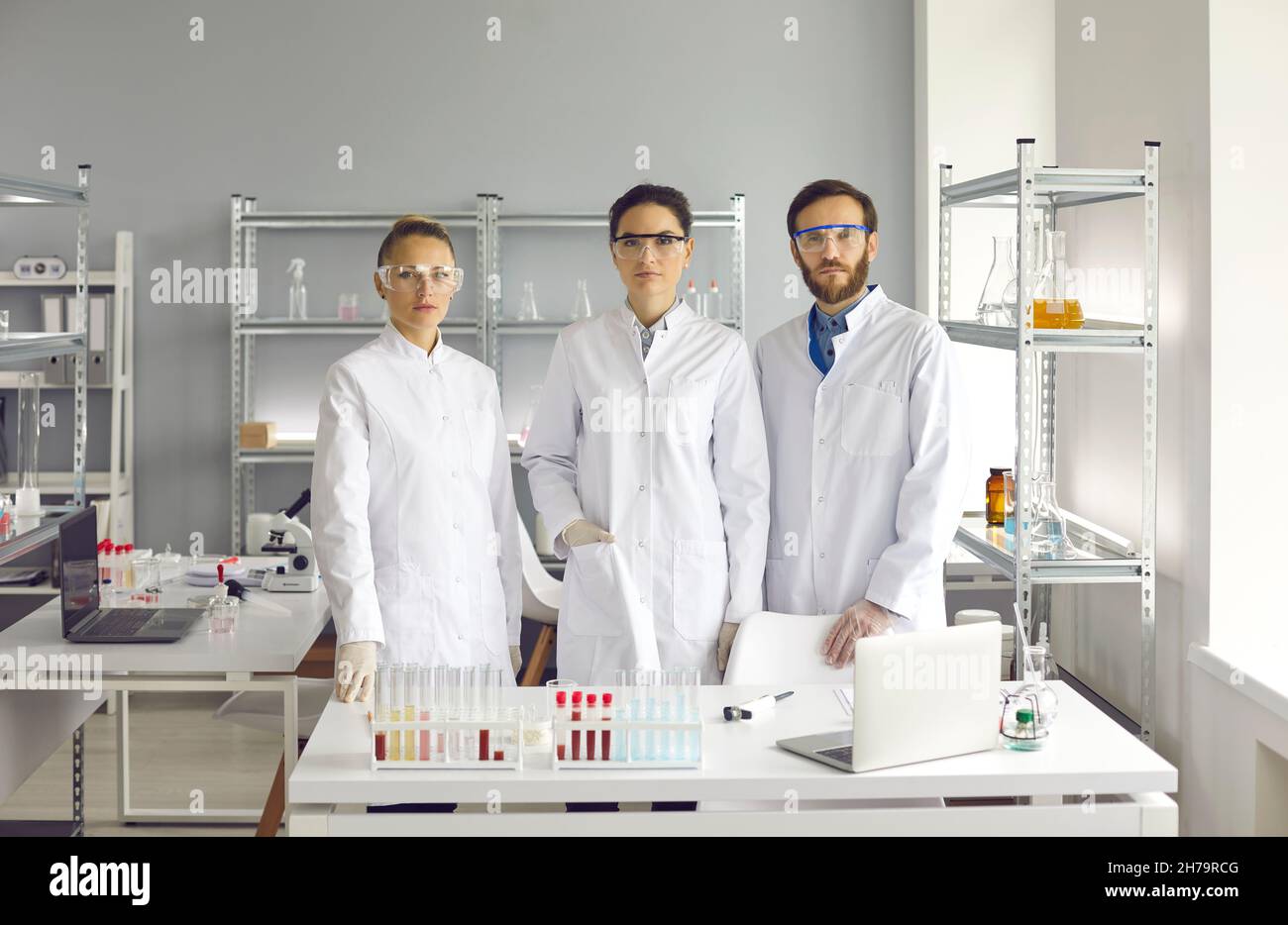 Medical Science Laboratory with a team of three successful young ...