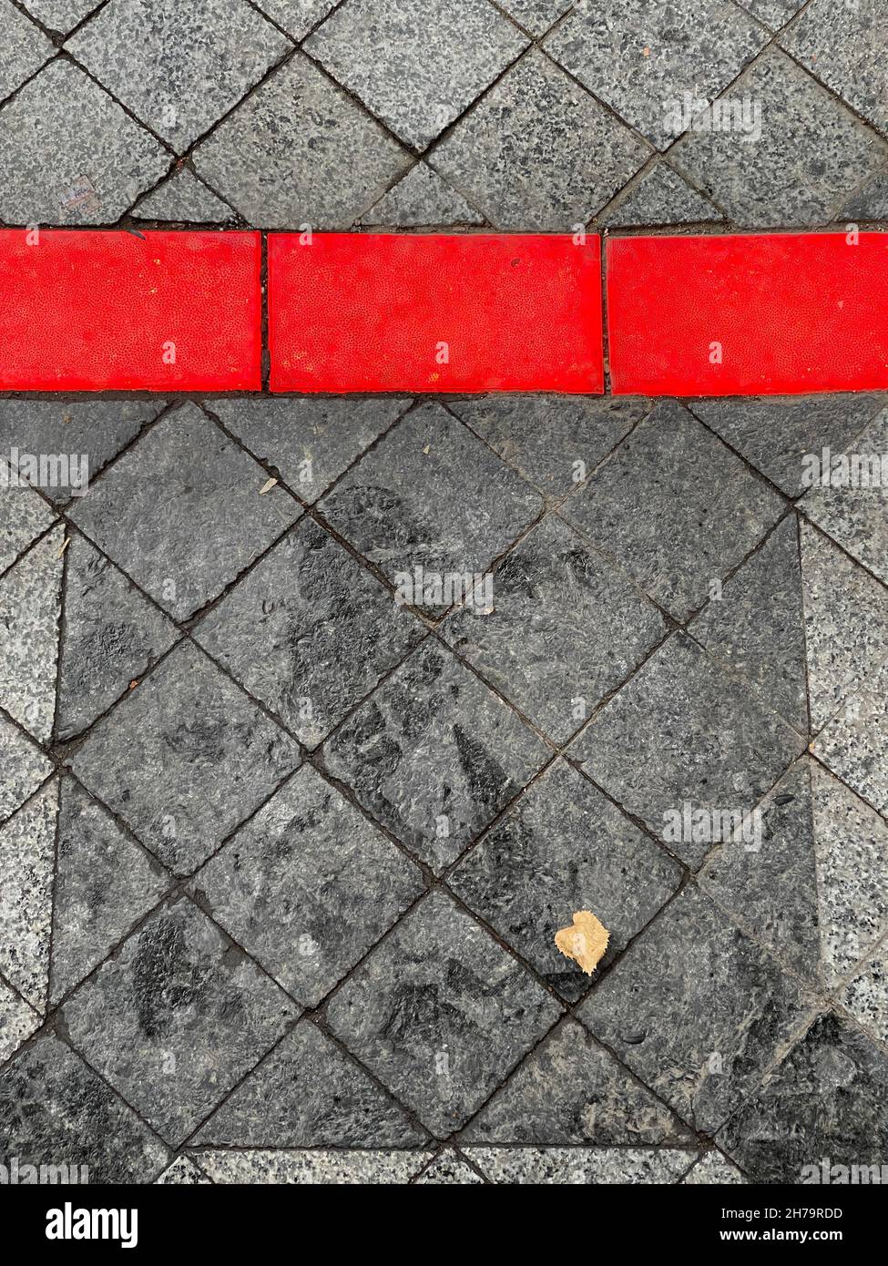 Top view shot of in-ground traffic lights glowing red for phone users ...