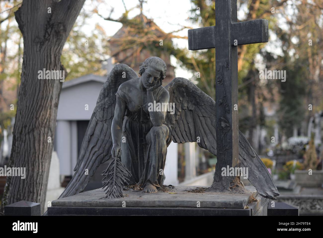 sad angel near cross Stock Photo - Alamy