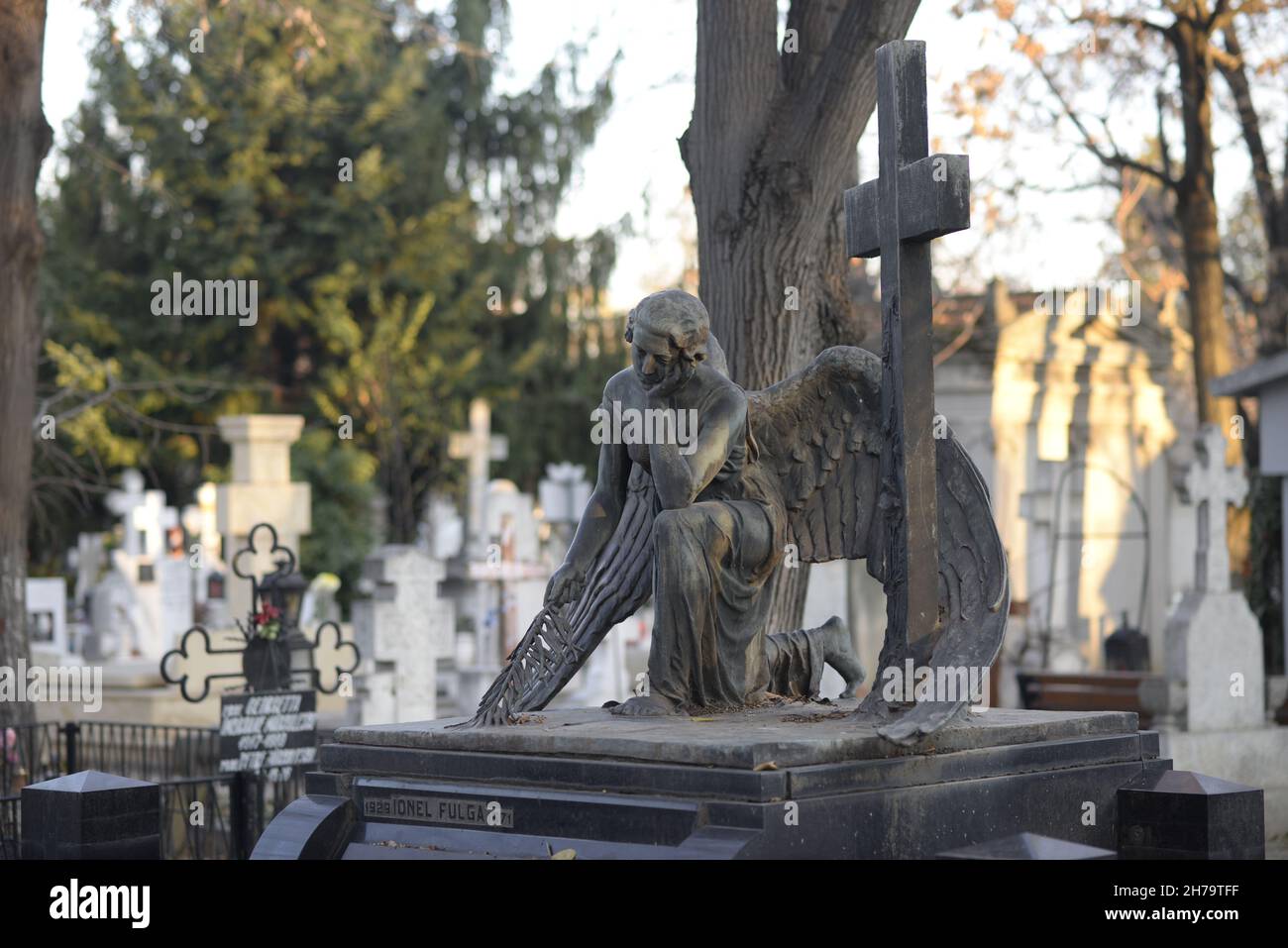 sad angel near cross Stock Photo - Alamy