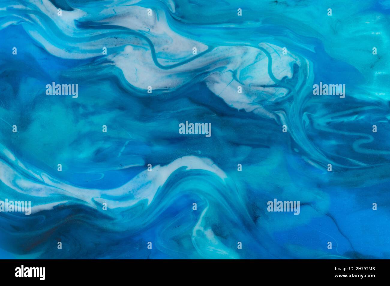 Epoxy resin art. Texture of blue and white paint. Fluid art, kintsugi ...