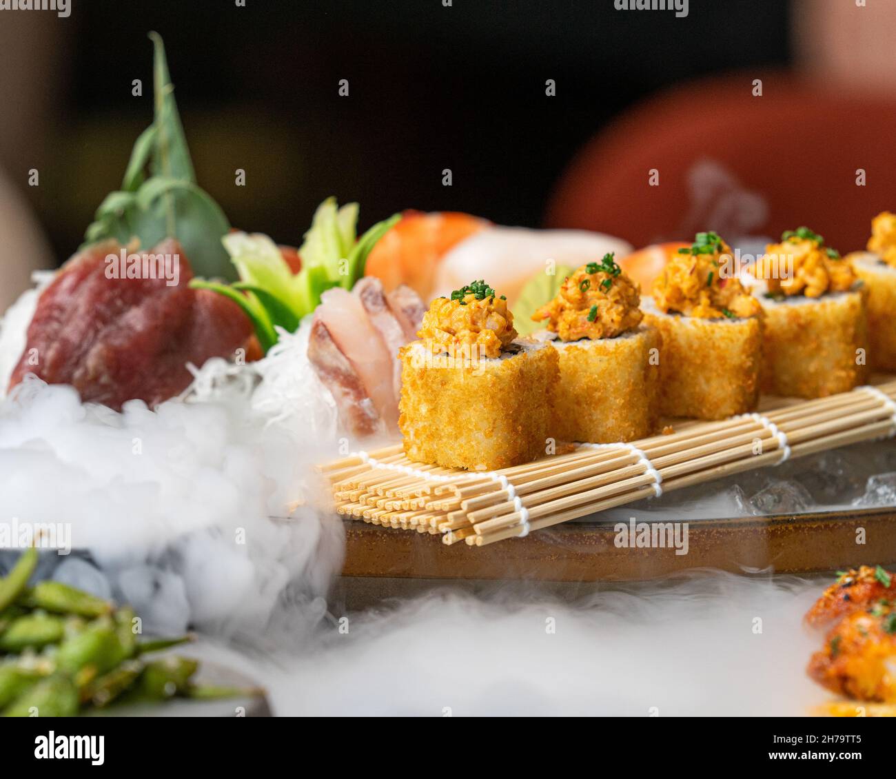 Assorted japanese sushi ans sashimi on a table Stock Photo - Alamy