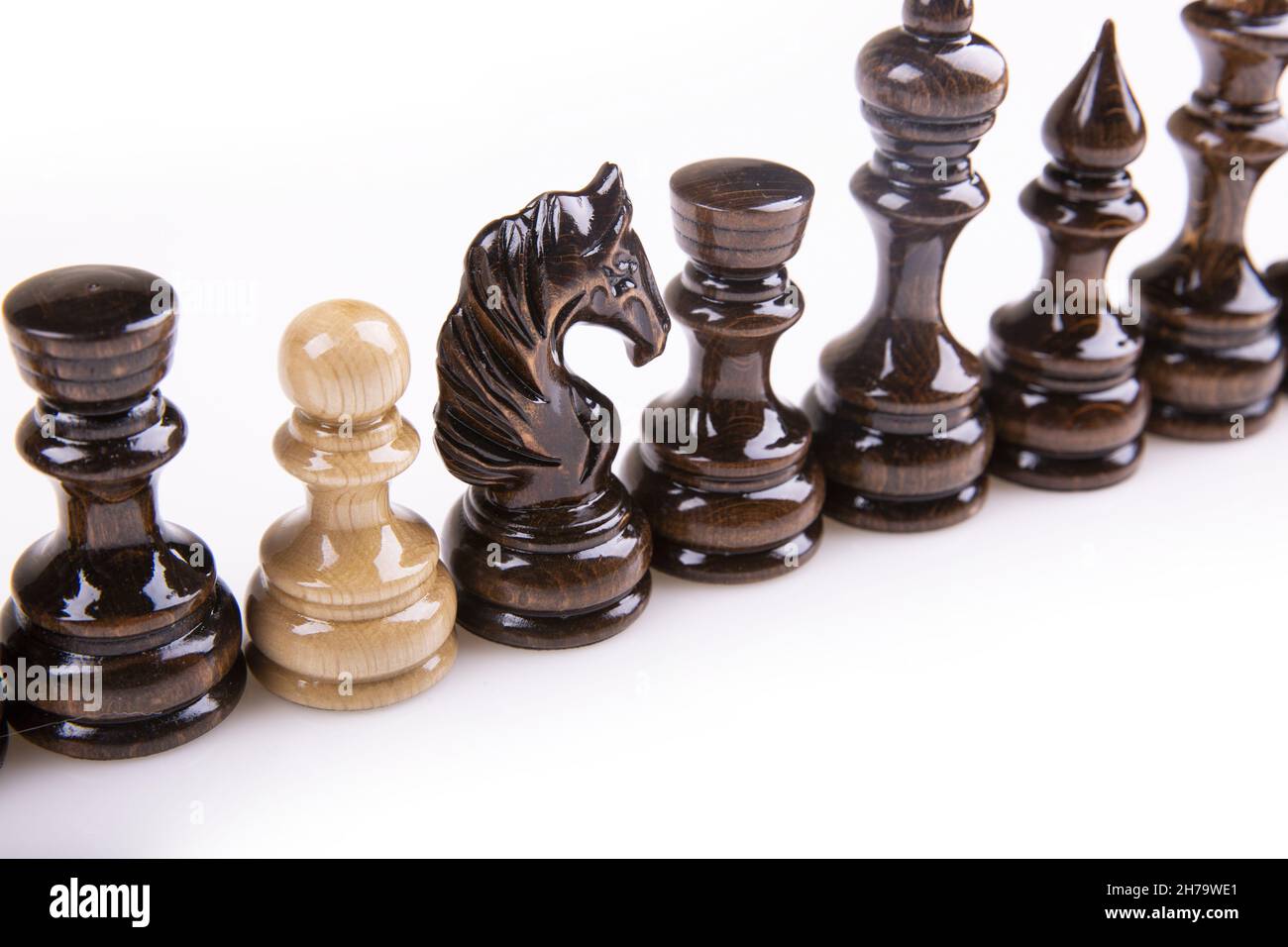 A single pawn in the same row with black chess pieces - the concept of ...