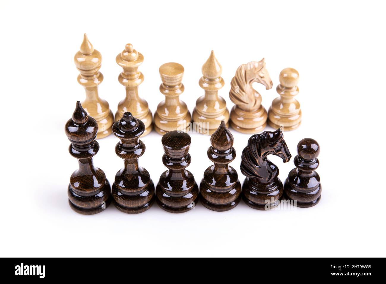 The black and white rows of chess pieces facing each other isolated on ...