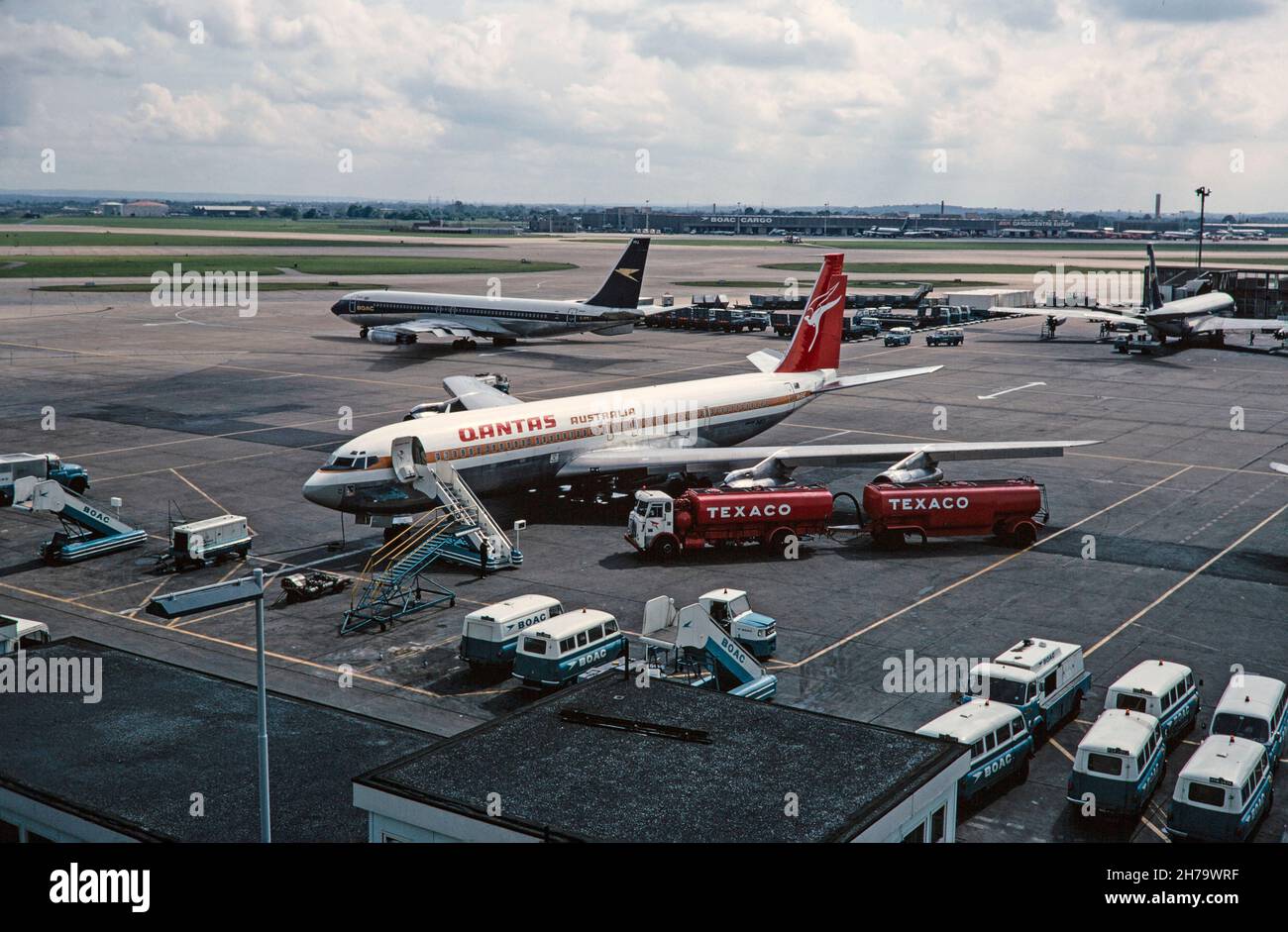 A vintage 1968 colour photo taken at London Heathrow Airport, showing a ...