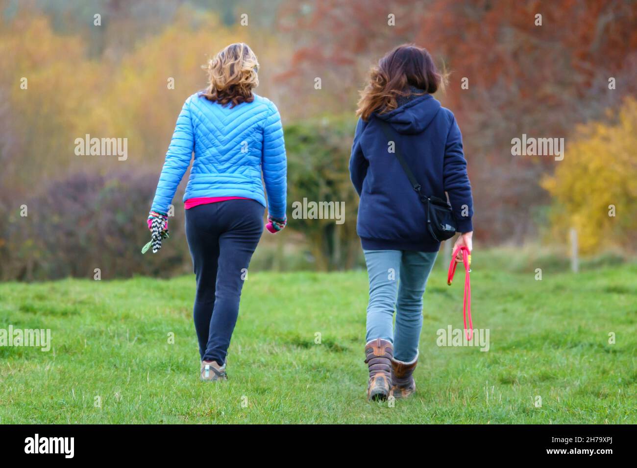 Two people walk across hi-res stock photography and images - Alamy
