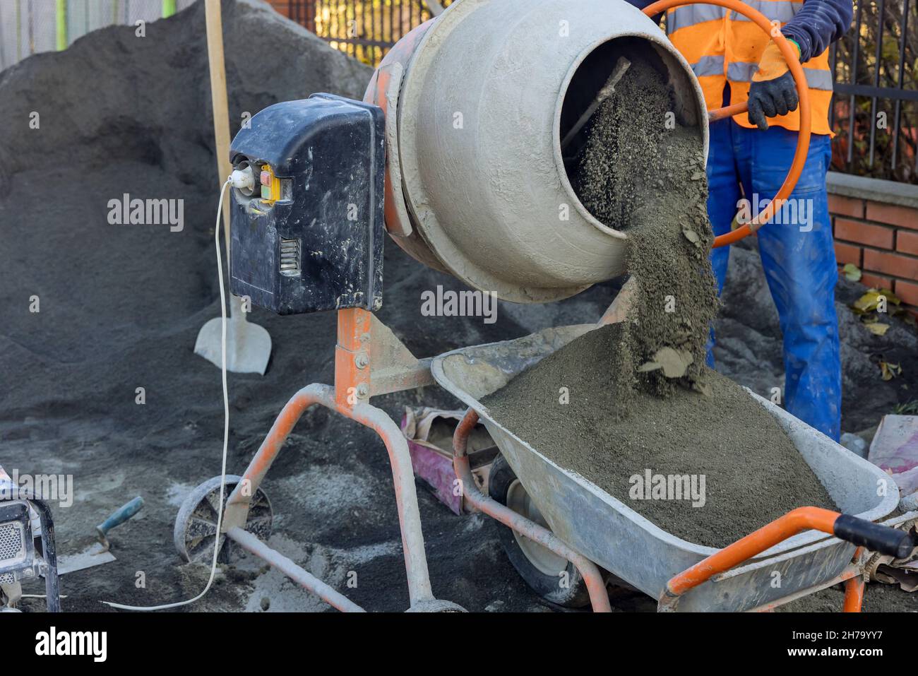 Preparation installation in progress with mixing a sandy base for stone ...