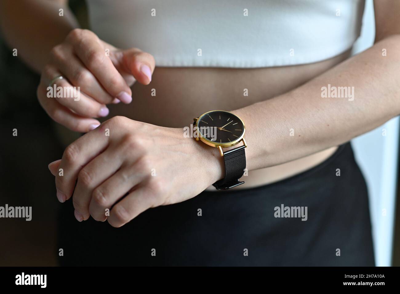 Man wearing gold watch hi-res stock photography and images - Alamy
