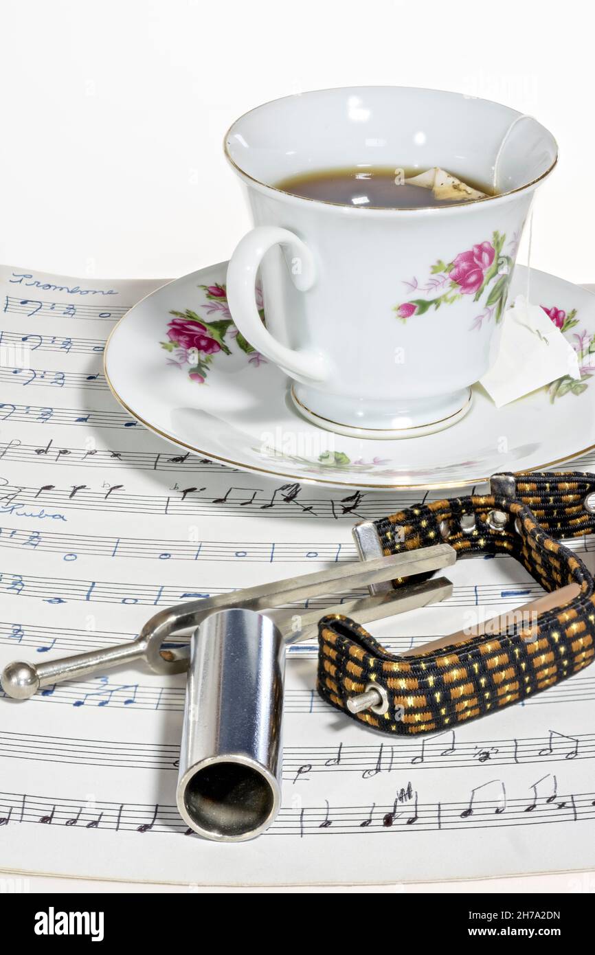 Musical instrument tools on music with hot tea Stock Photo - Alamy