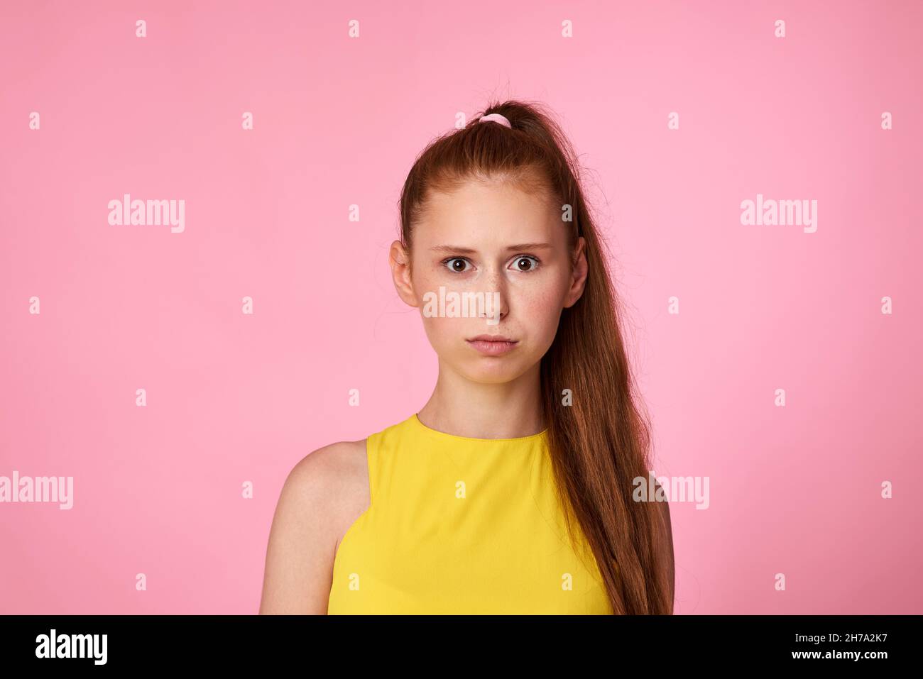 upset unsatisfied teen girl on pink background. Human emotions, facial ...
