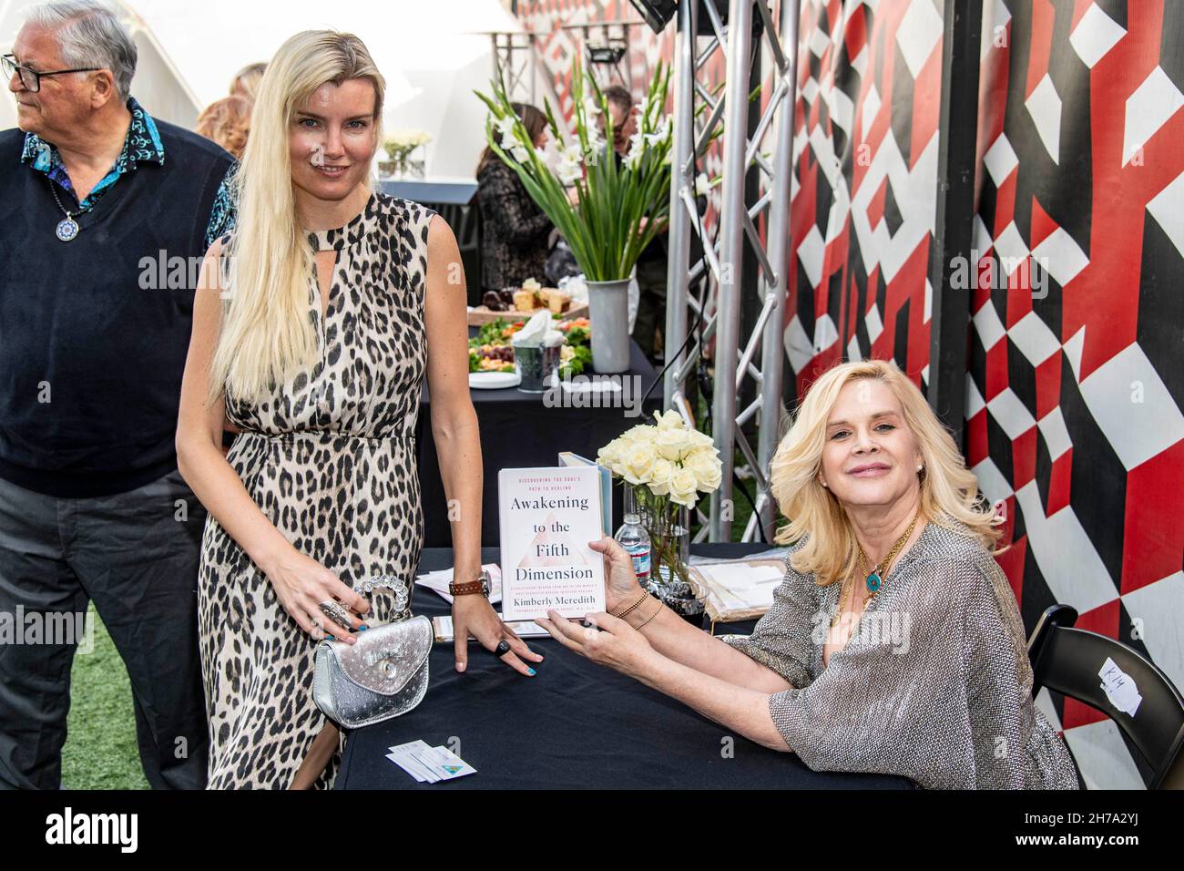 Kimberly Meredith signs a book for Eugenia Kuzmina at Kimberly Meredith ...