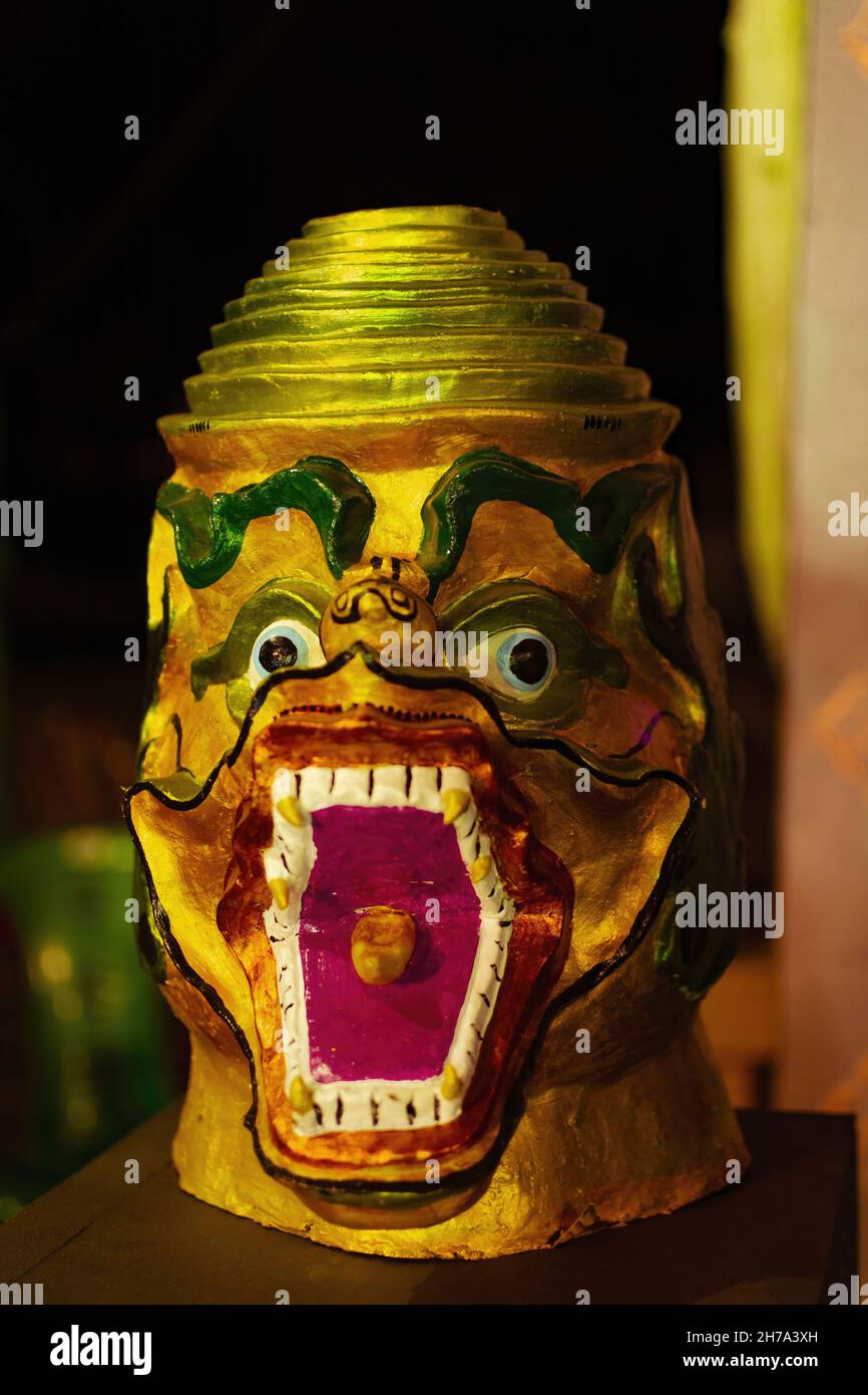 A demon face artwork decorating a Durga Puja pandel Stock Photo - Alamy