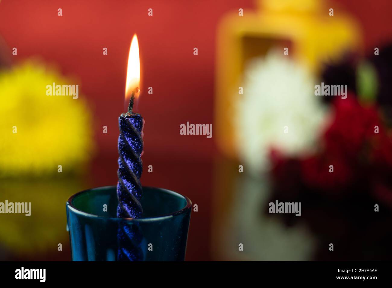 Closeup Of Glittering Blue Designer Pillar Candle Illuminated With ...