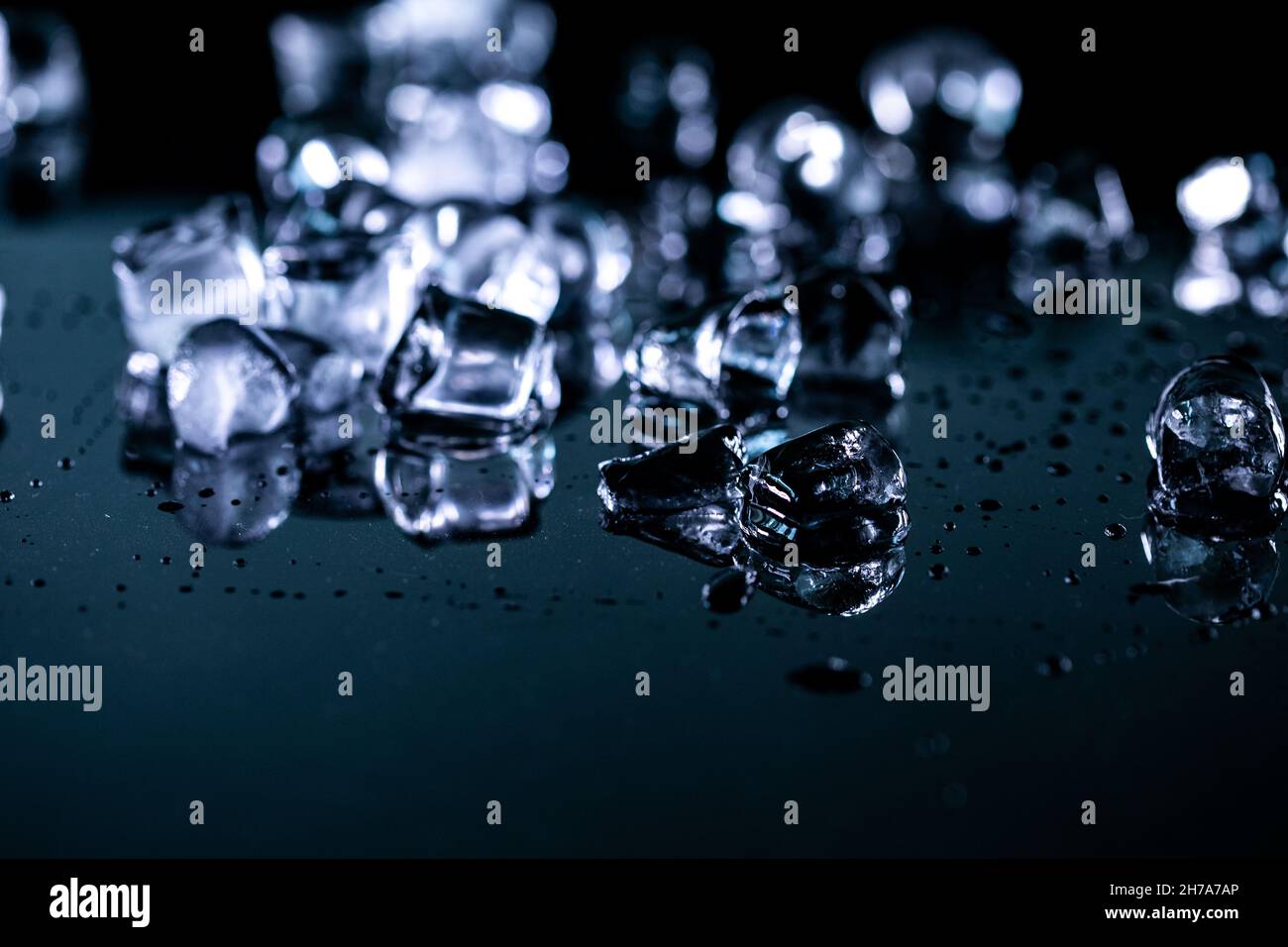 ice cubes reflection on black background. close up Stock Photo - Alamy