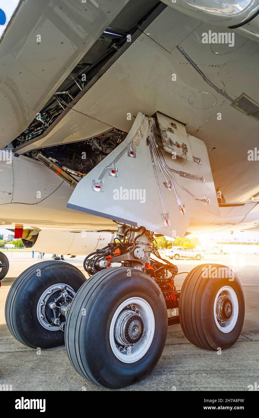 Huge chassis gear wheels of the aircraft rubber discs under the wing in ...