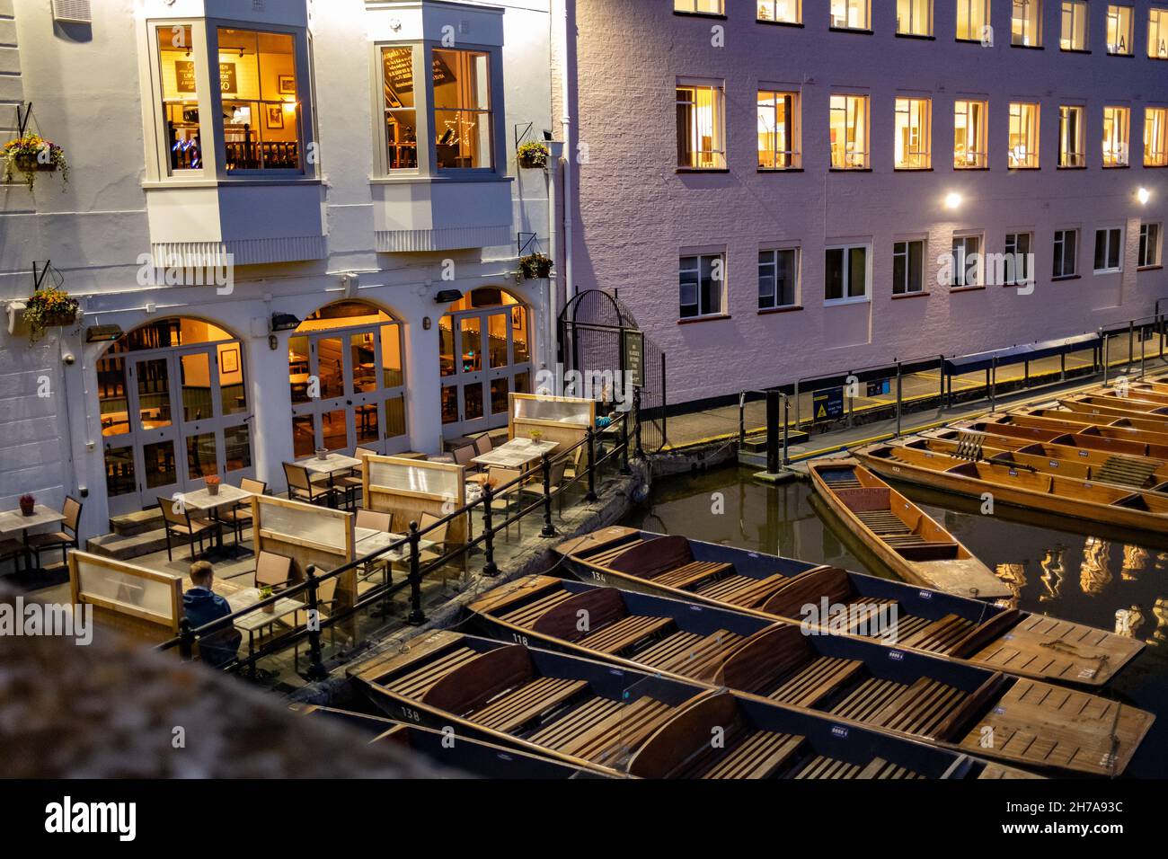 Traditional wooden punts moored up outside The Anchor Pub in the city ...
