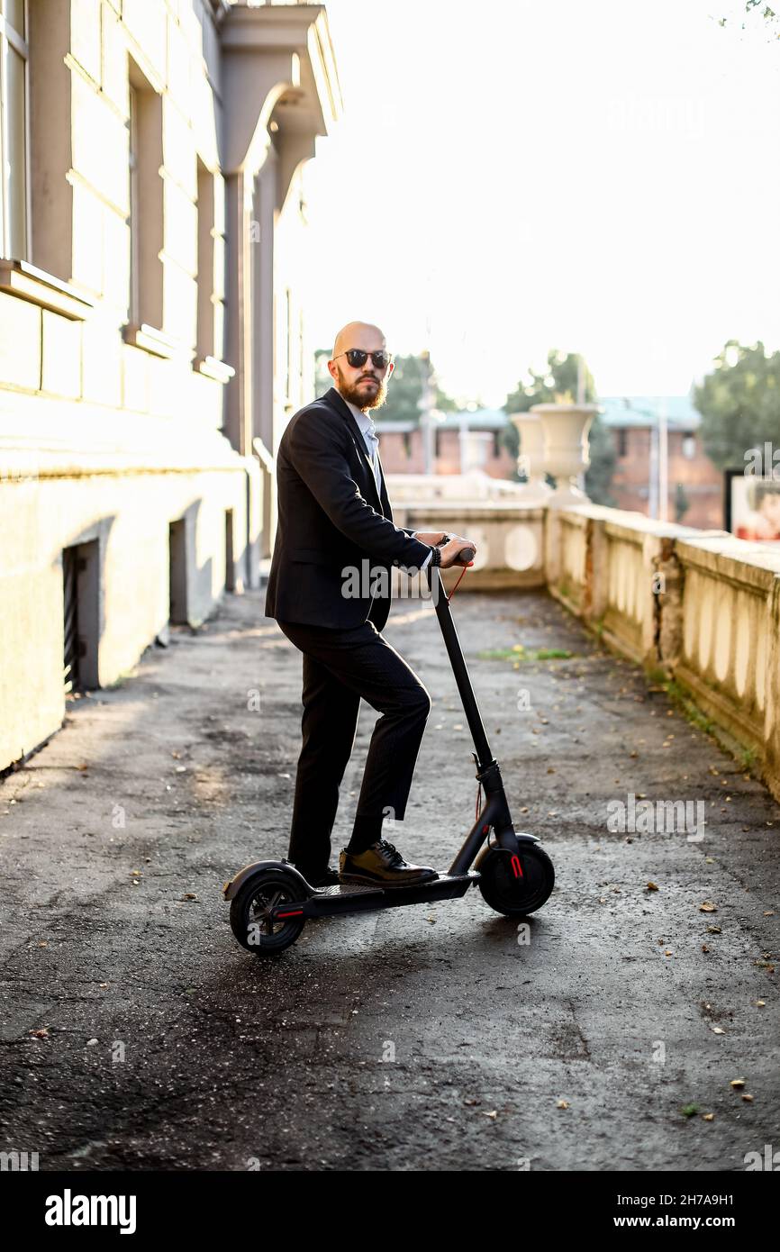 Riding a kick scooter hi-res stock photography and images - Alamy