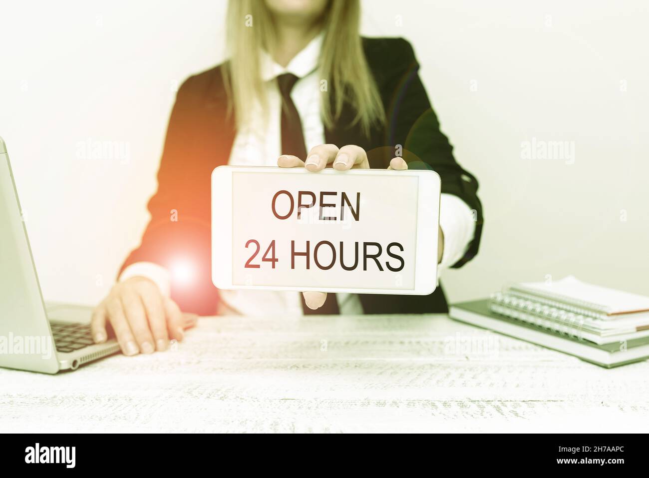 Sign displaying Open 24 Hours. Business showcase available all day and ...