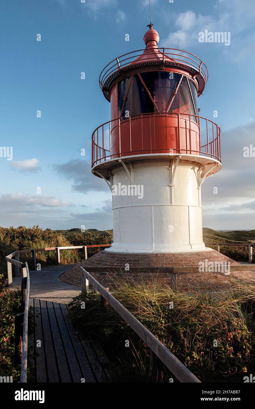 Red and white building of naval lighthouse. Formerly used for ship ...