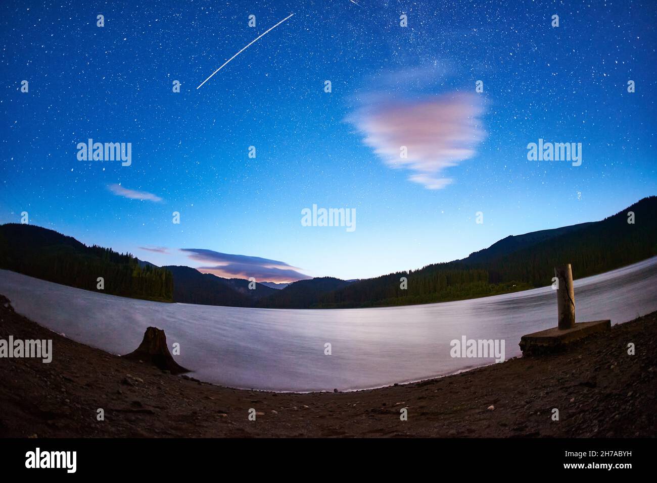 The beautiful view of the lakeshore with a starry sky Stock Photo - Alamy