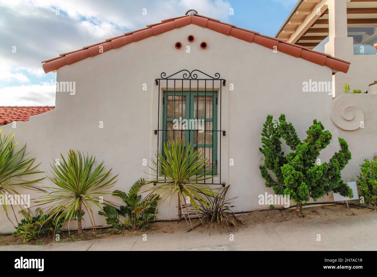 Green wooden hinged window with railings at La Jolla, California. There ...