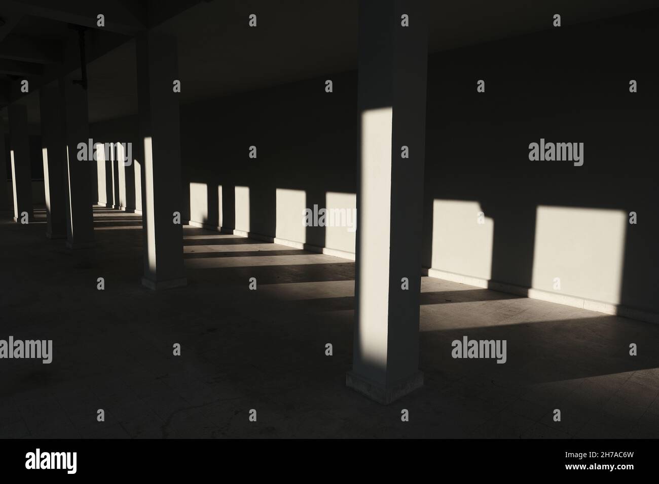 The white pillars of a building with beautiful shadow Stock Photo - Alamy