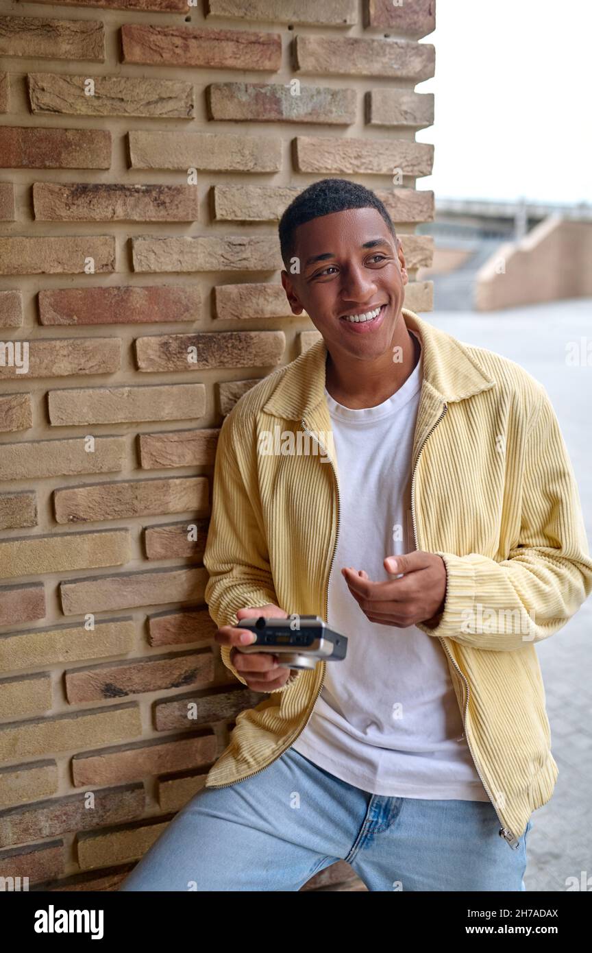 Smiling young male photographer feeling good and contented Stock Photo ...