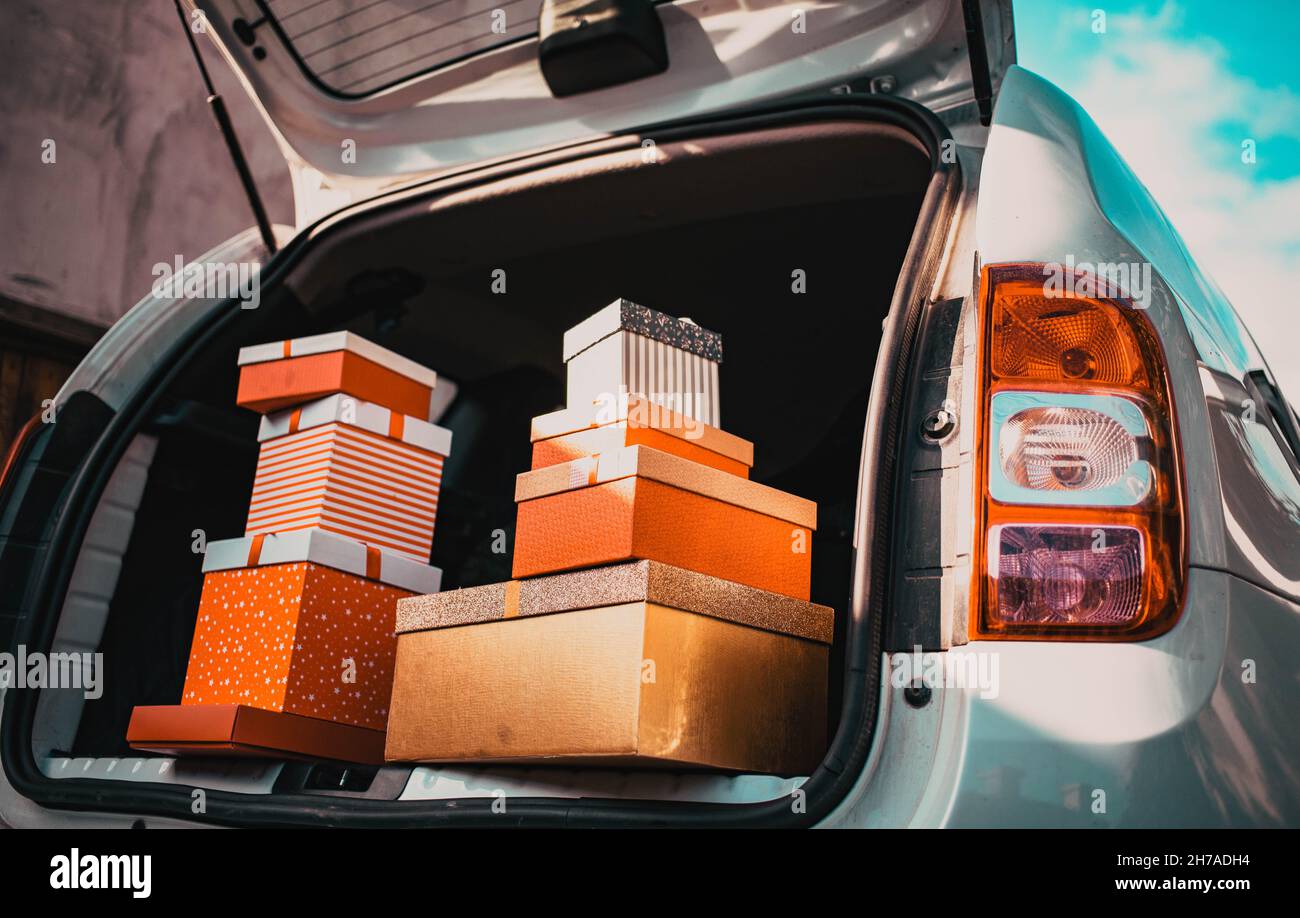 pile of Christmas gift boxes in car Stock Photo - Alamy