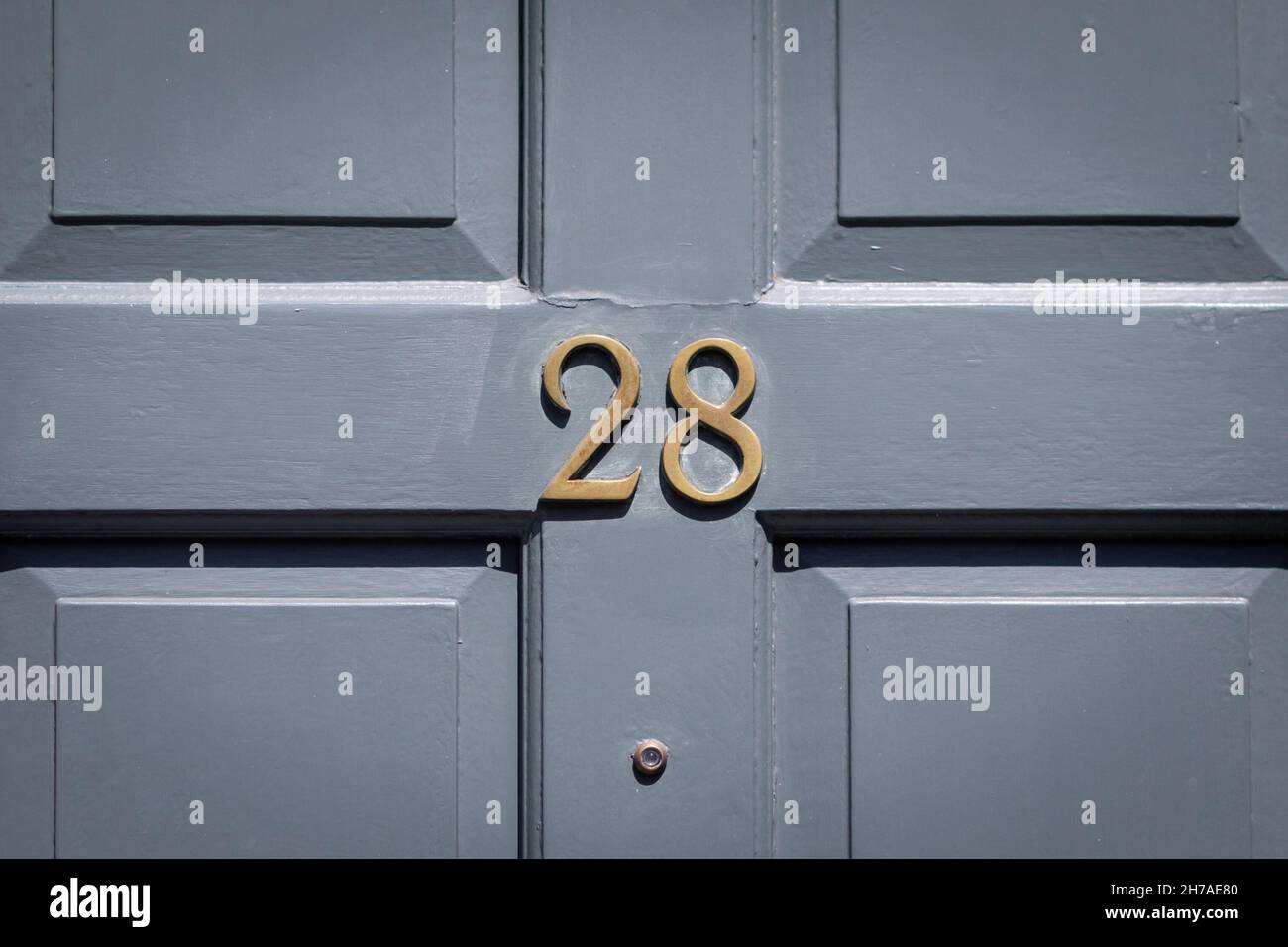 House door number 28 on a wooden front door in London, Britain Stock ...
